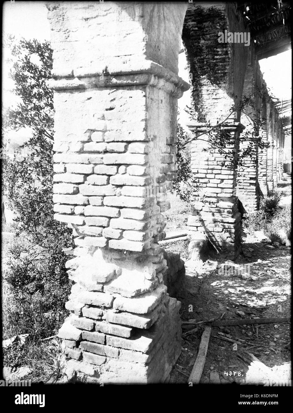 Crumbling brick pillars of the corridor at Mission San Antonio de Padua ...