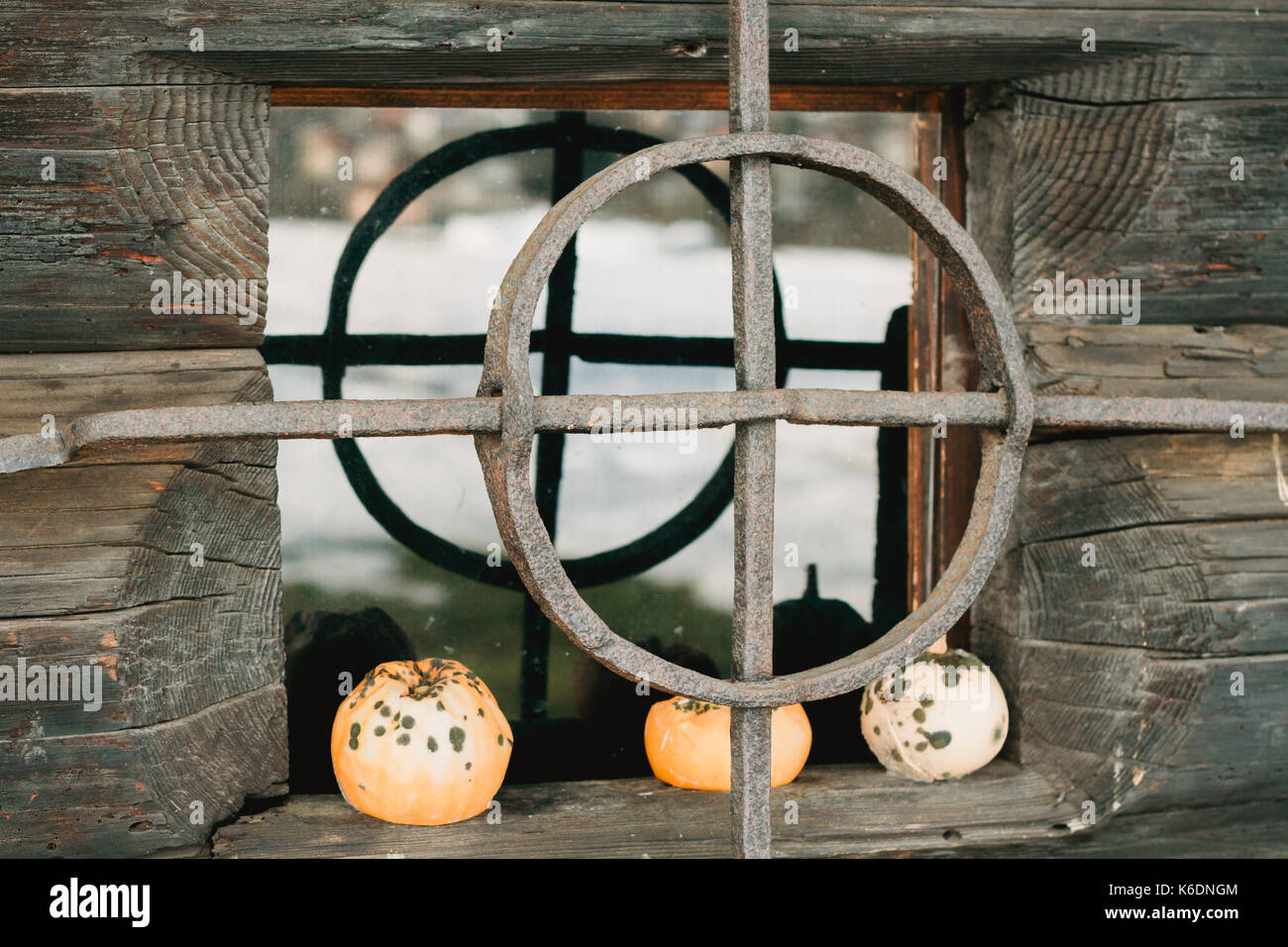 Pumpkins on display on window of wooden house Stock Photo - Alamy