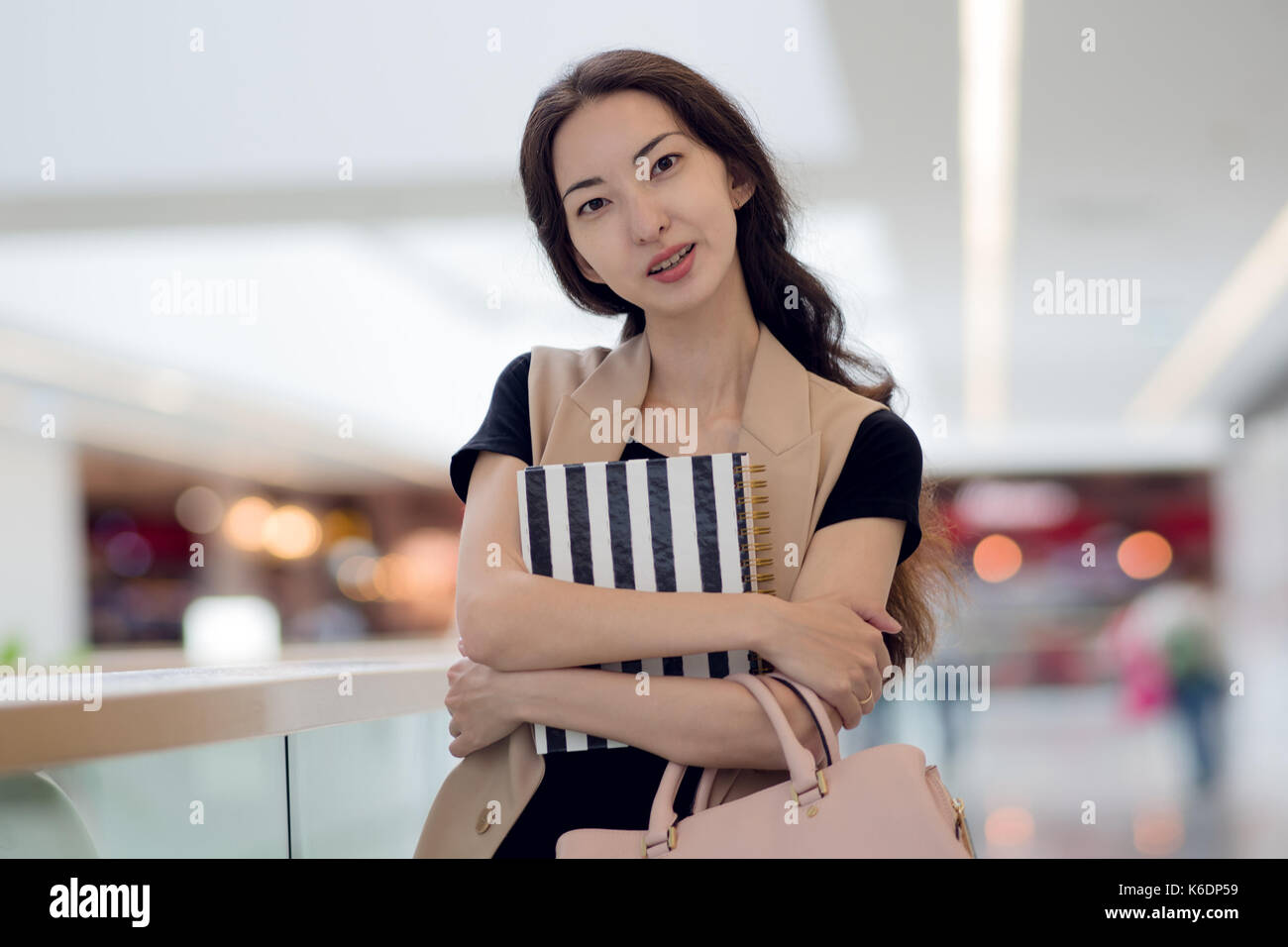 Beautiful girl with a diary in hand, the portrait in the lobby of ...