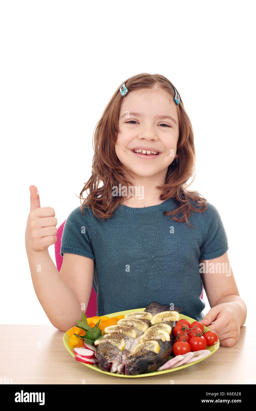 happy little girl with fish and thumb up Stock Photo - Alamy