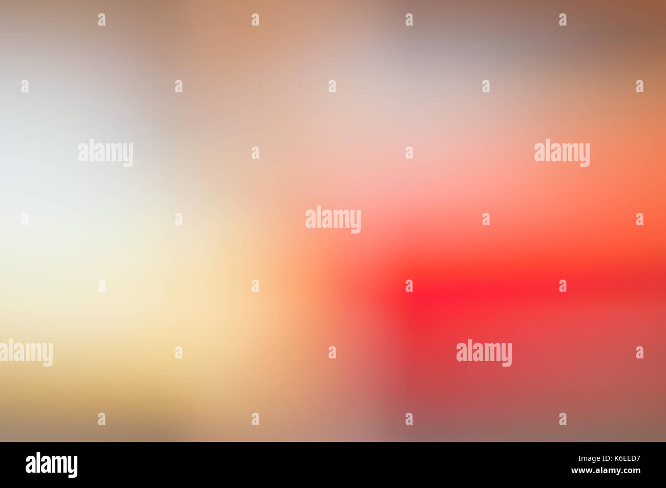 Abstract, soft background blur with merging hues of white, yellow and ...