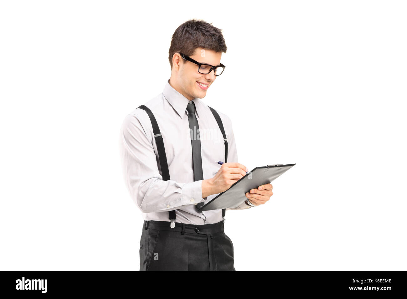 Classy guy writing in a clipboard isolated on white background Stock ...