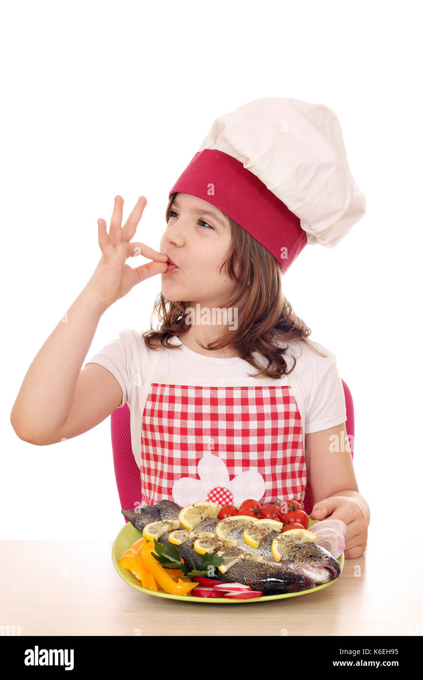 little girl cook with prepared trout on plate Stock Photo - Alamy