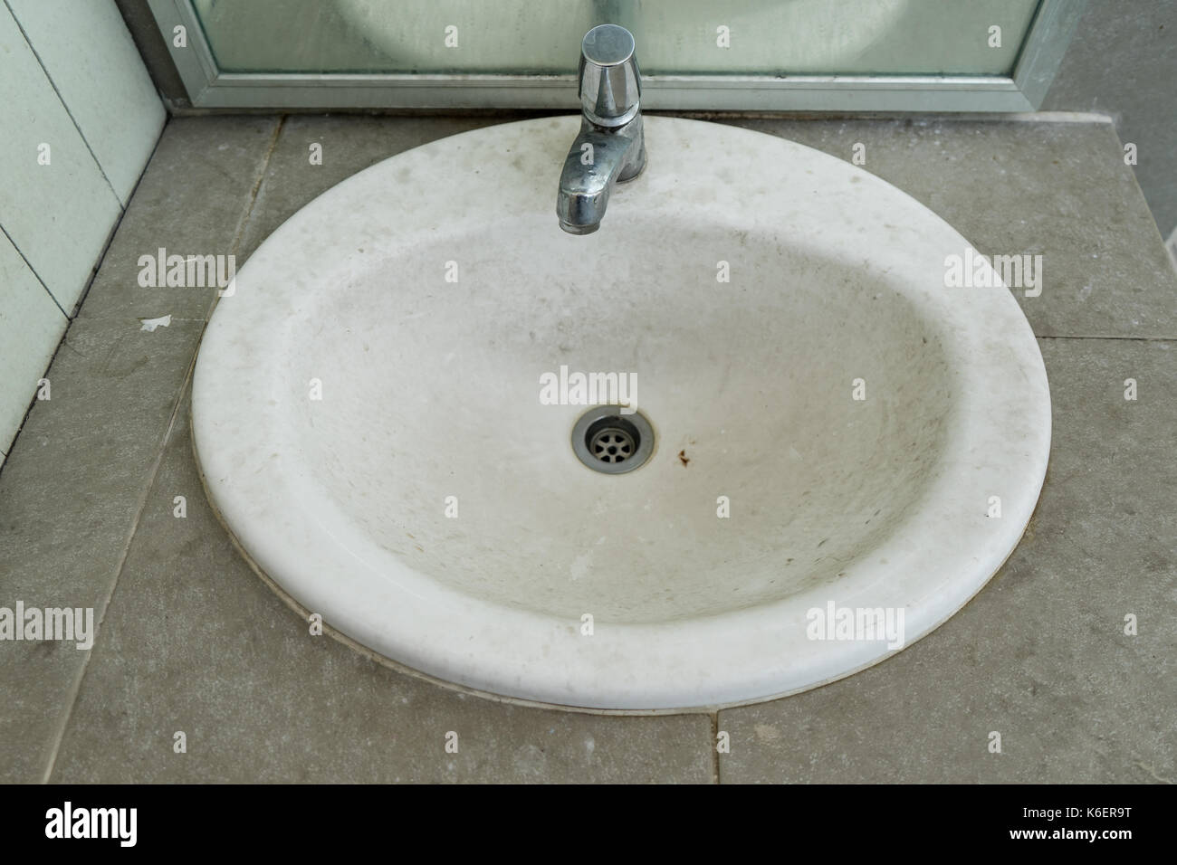 Dirty wash basin in men's bathroom Stock Photo - Alamy