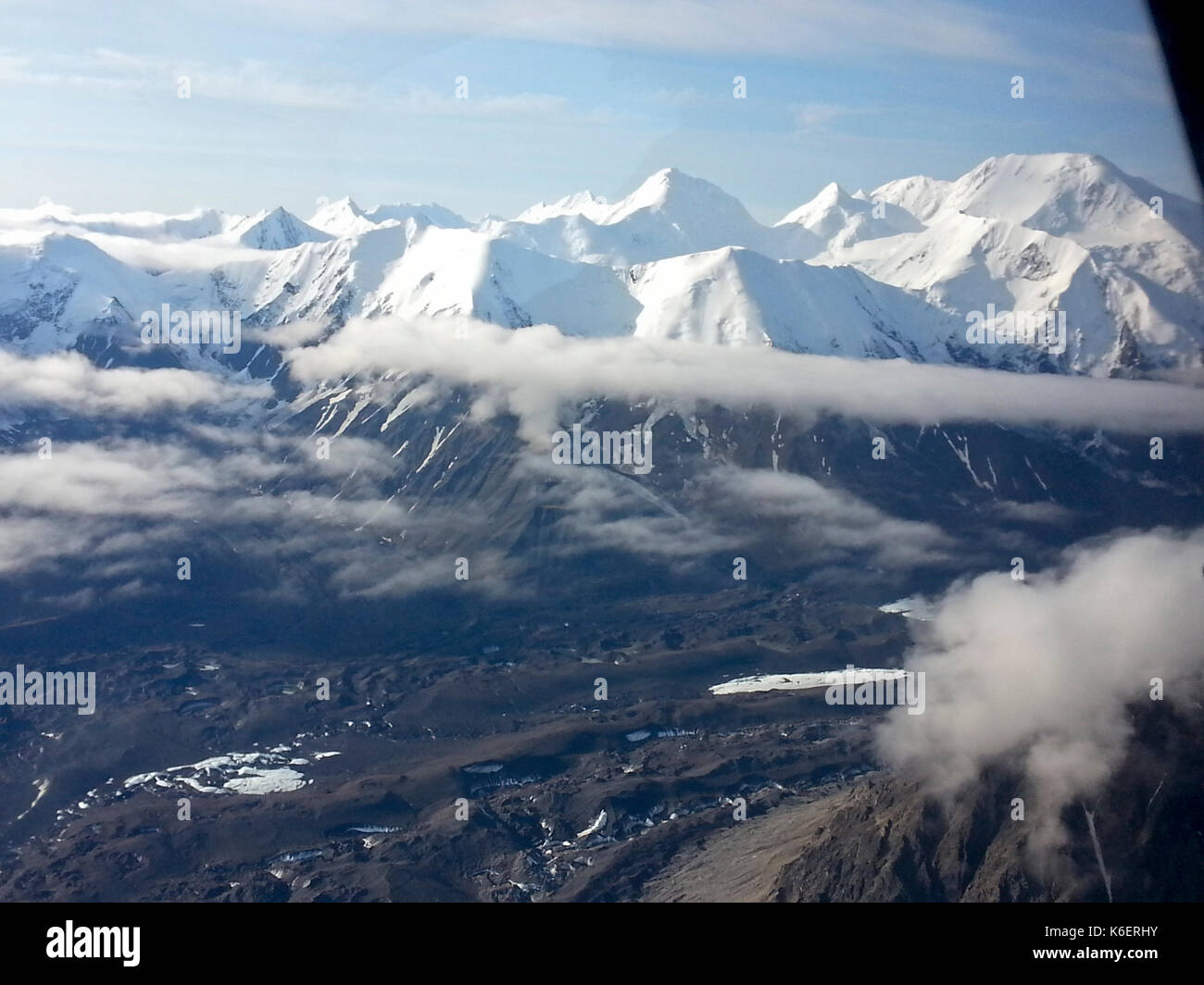 AERIAL VIEW FROM TOURING AIRPLANE OF SNOW CAPPED MOUNTAINS, ALASKA ...