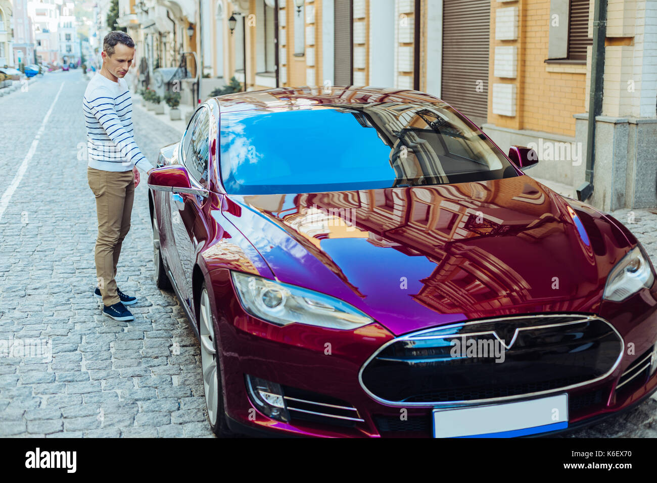 Nice handsome man standing near his car Stock Photo - Alamy