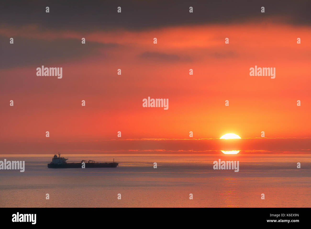 ship on the sea at the sunset Stock Photo - Alamy