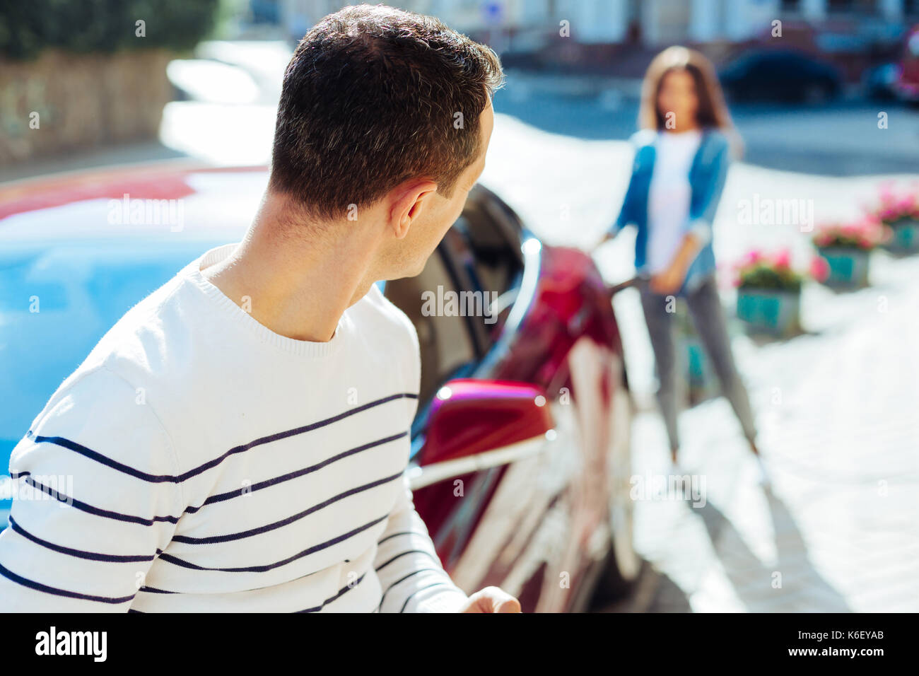 Nice handsome man standing in front of his car Stock Photo - Alamy