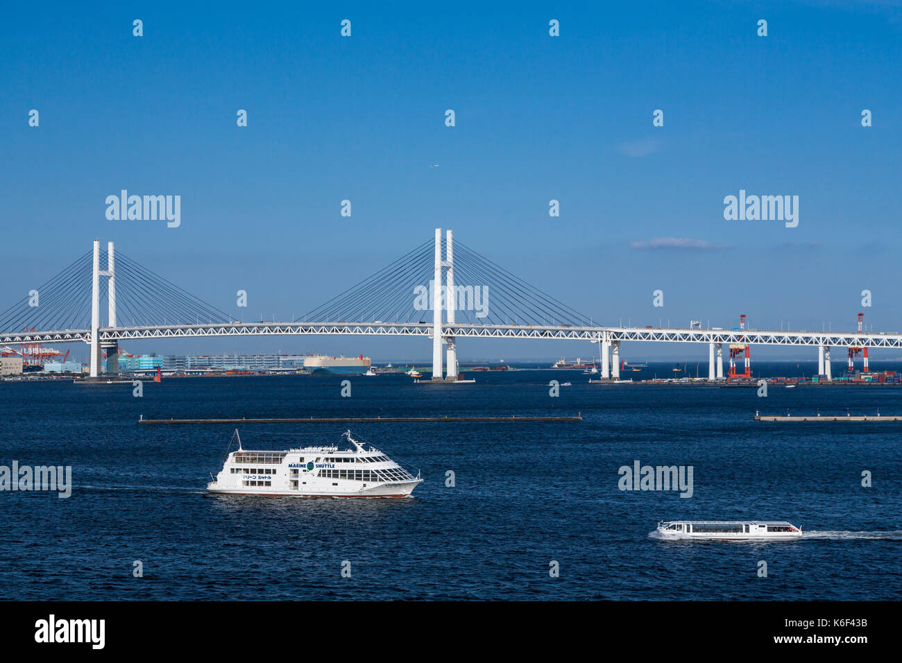 The harbor and Yokohama Bay bridge at the port city of Yokohama, Japan ...