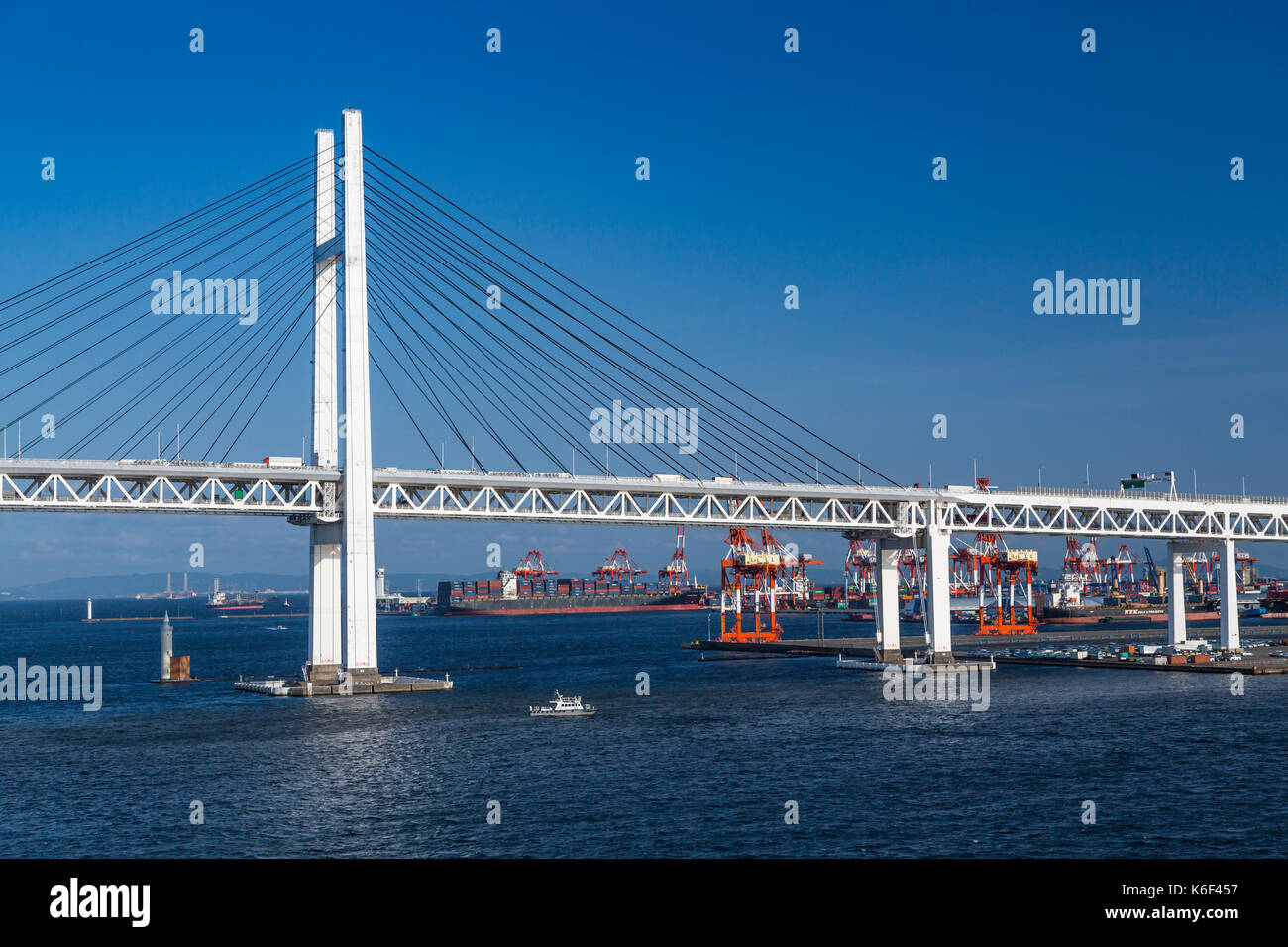 The harbor and Yokohama Bay bridge at the port city of Yokohama, Japan ...