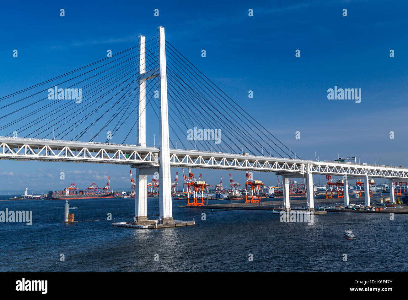 The harbor and Yokohama Bay bridge at the port city of Yokohama, Japan ...