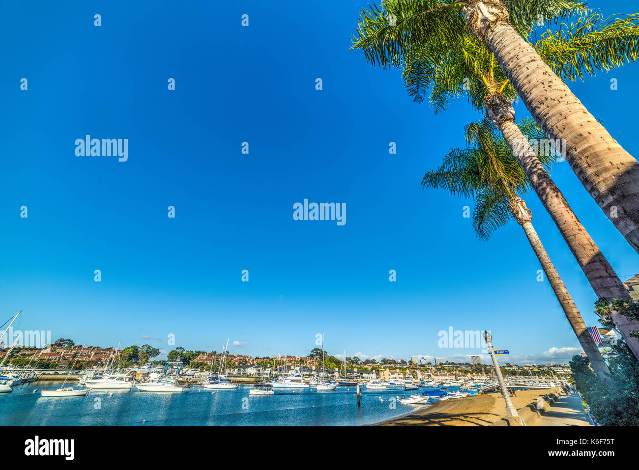 Sun shining over Balboa Island harbor Stock Photo - Alamy