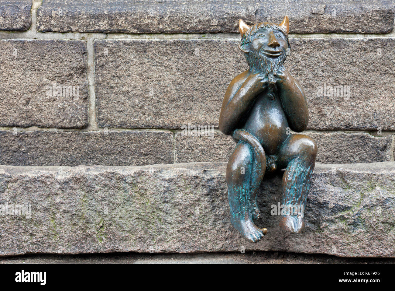 Cute little bronze devil sculpture on the Devil’s Stone at Lübecker ...