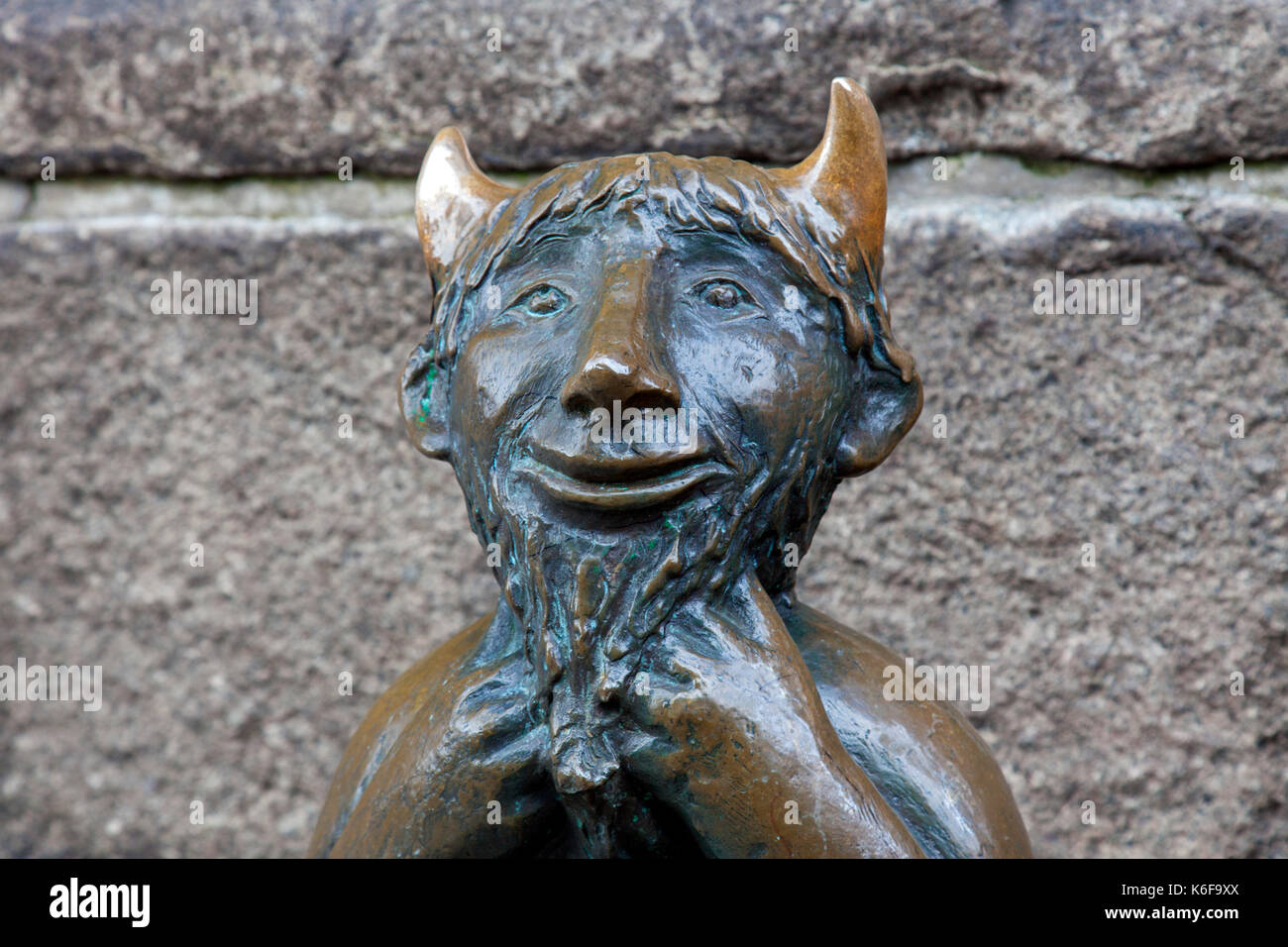 Cute little bronze devil sculpture on the Devil’s Stone at Lübecker ...