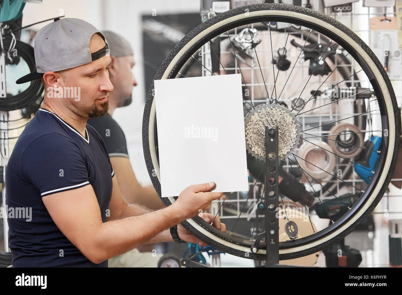 Bicycle mechanic in a workshop in the repair process Stock Photo - Alamy