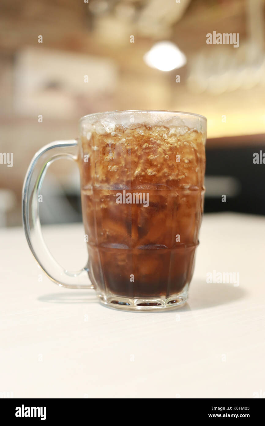 Coca Cola glass on the food table in the restaurant Stock Photo - Alamy