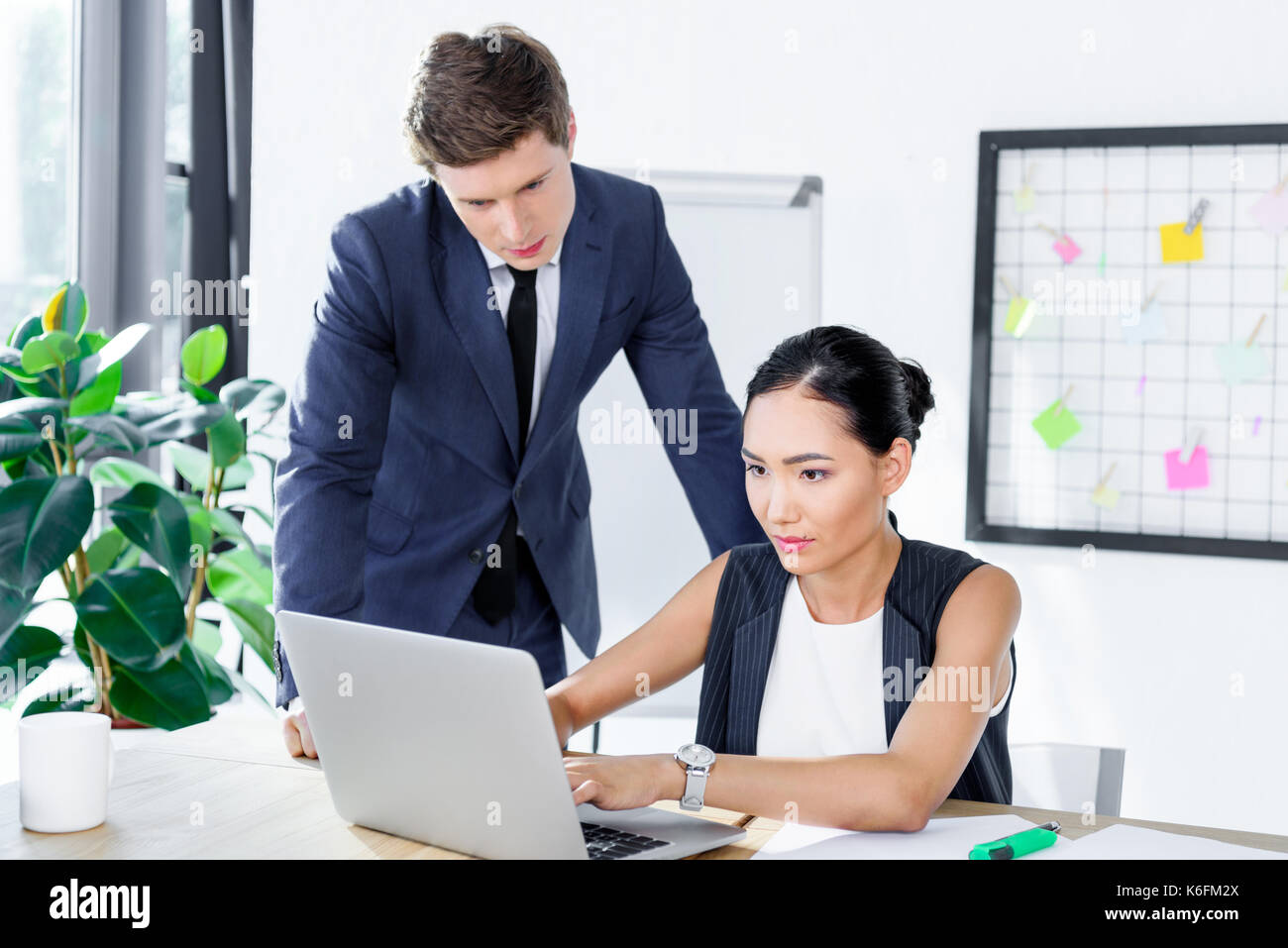 multiethnic business people working on laptop Stock Photo - Alamy
