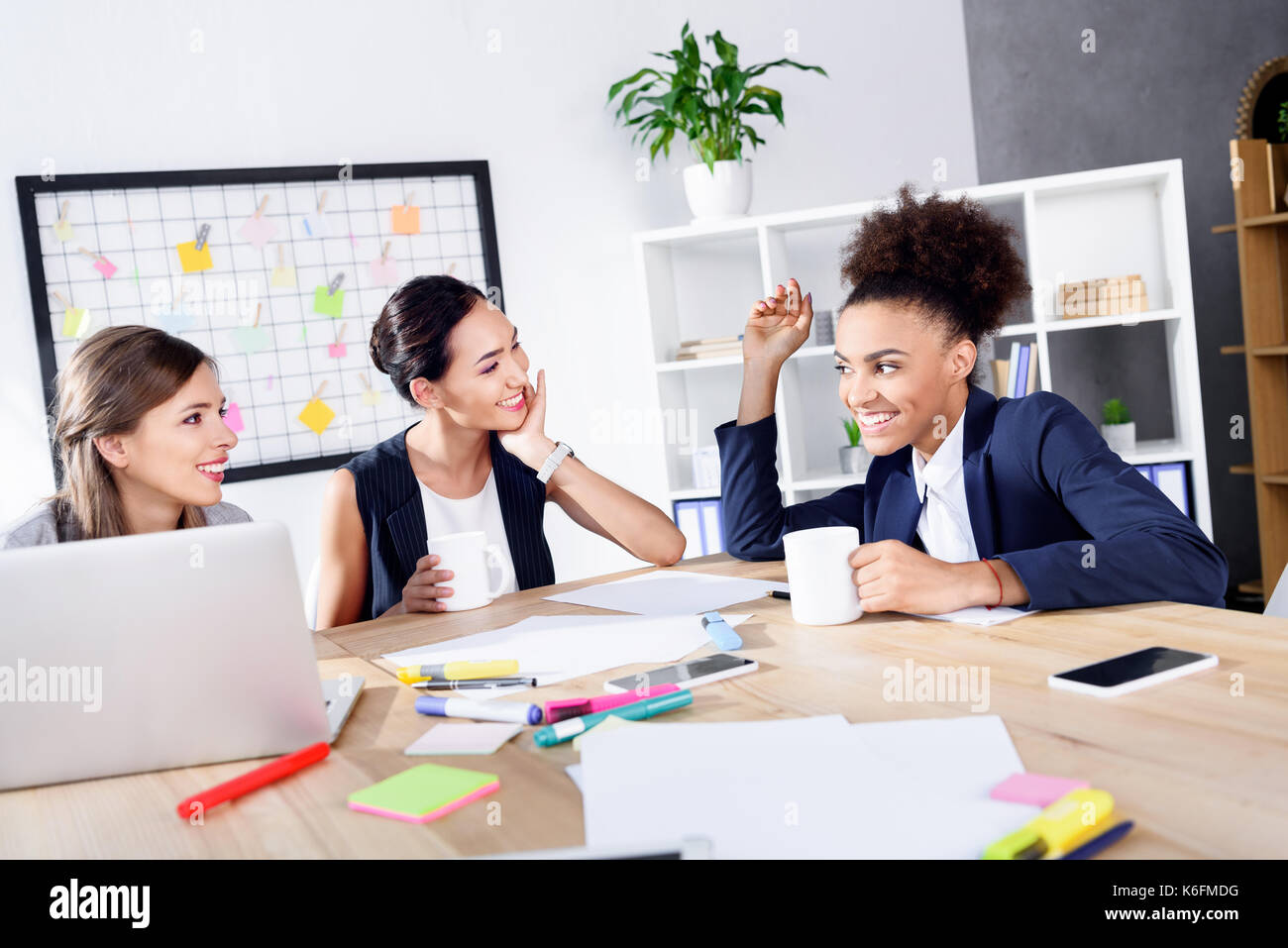 businesswomen talking and drinking coffee Stock Photo - Alamy