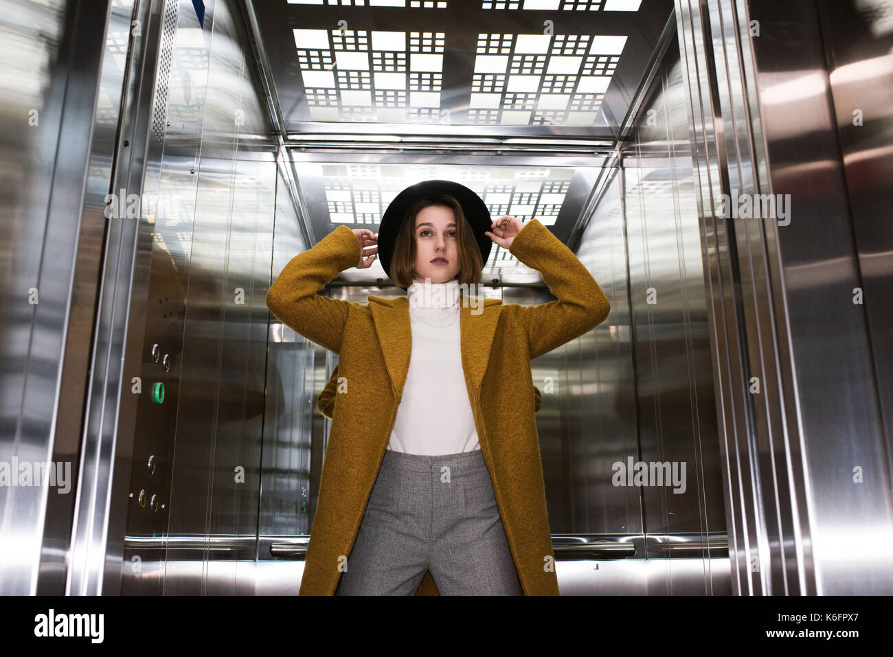 fashionable woman in elevator Stock Photo - Alamy