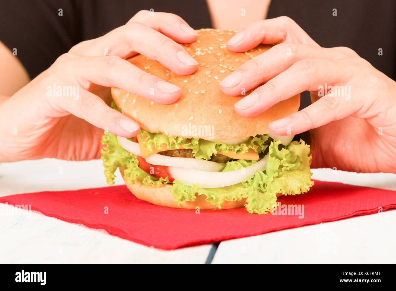 Biting Into Hamburger High Resolution Stock Photography and Images - Alamy