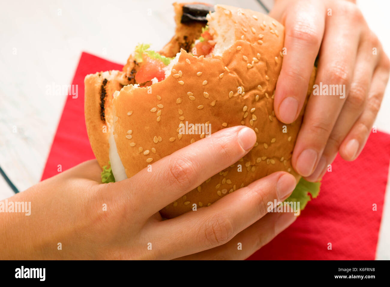 Biting into hamburger hi-res stock photography and images - Alamy