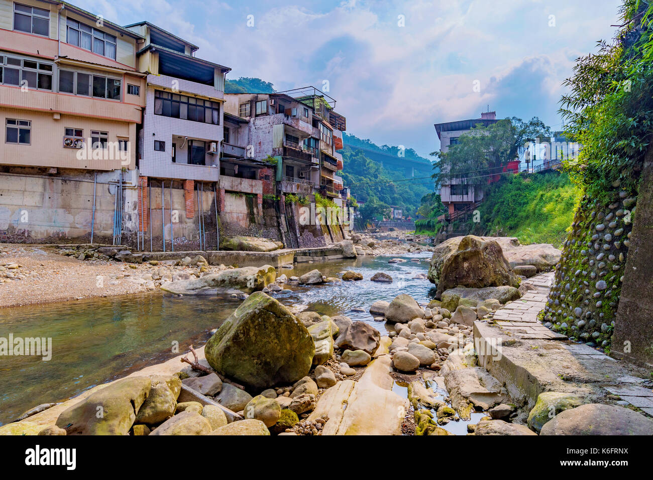Scenic view of river and old buildings in Shiding district Stock Photo ...