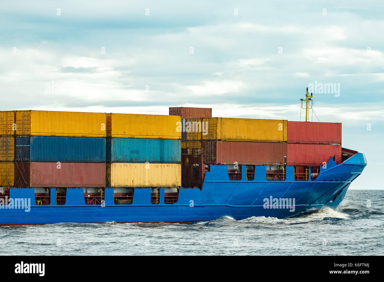 Blue cargo container ship fully loaded underway Stock Photo - Alamy