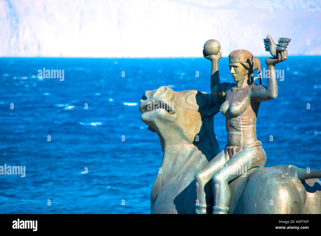 Europa - Statue on the quay in front of the port of the coastal town of ...