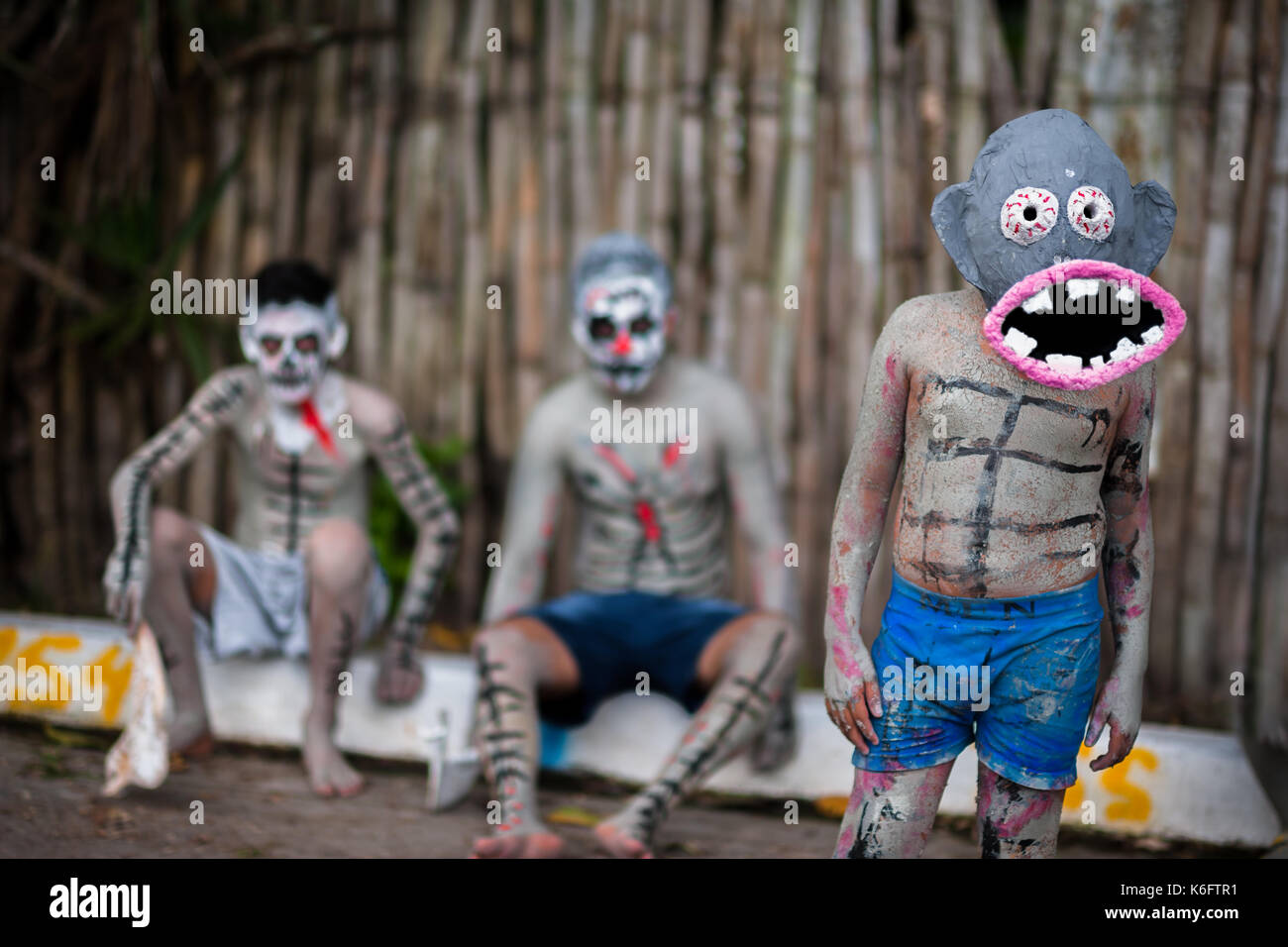Salvadoran boys, painted an ashen grey and wearing masks, perform ...