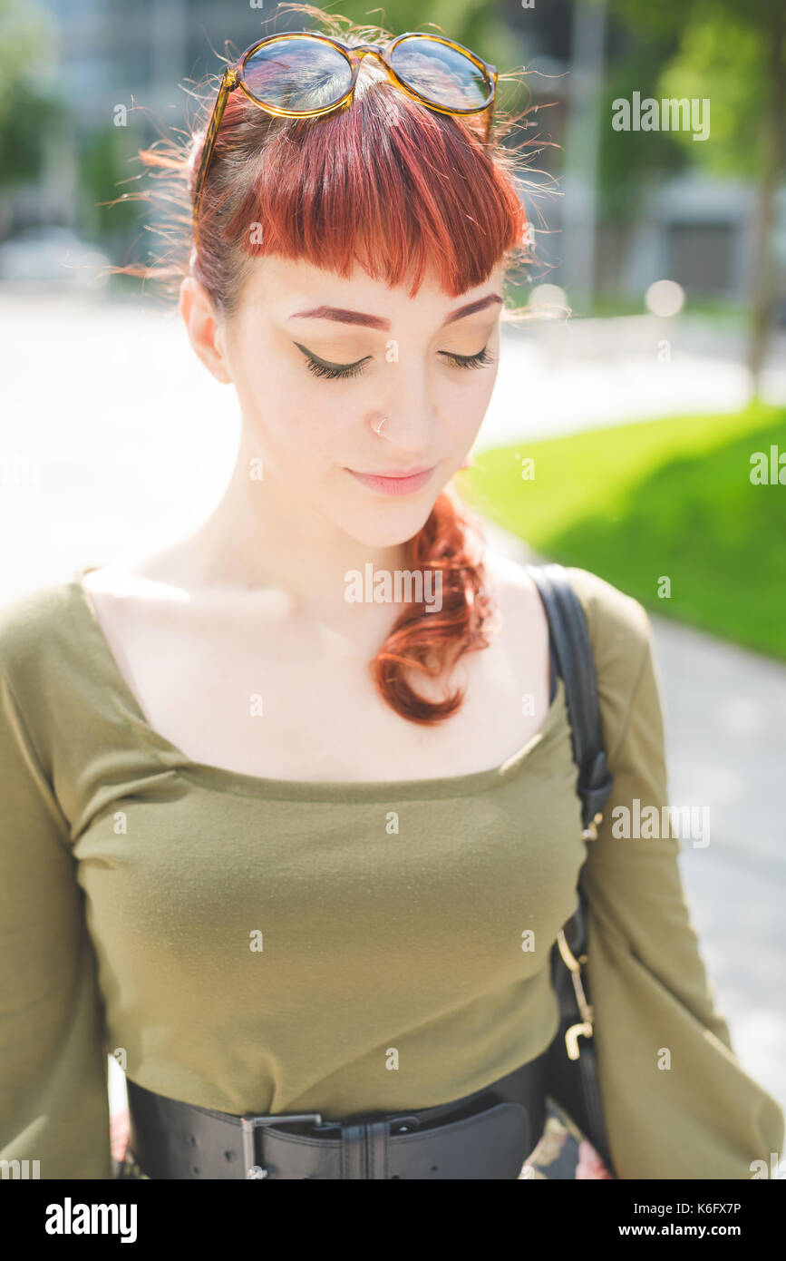 portrait young woman beautiful posing outdoor looking down - attitude ...