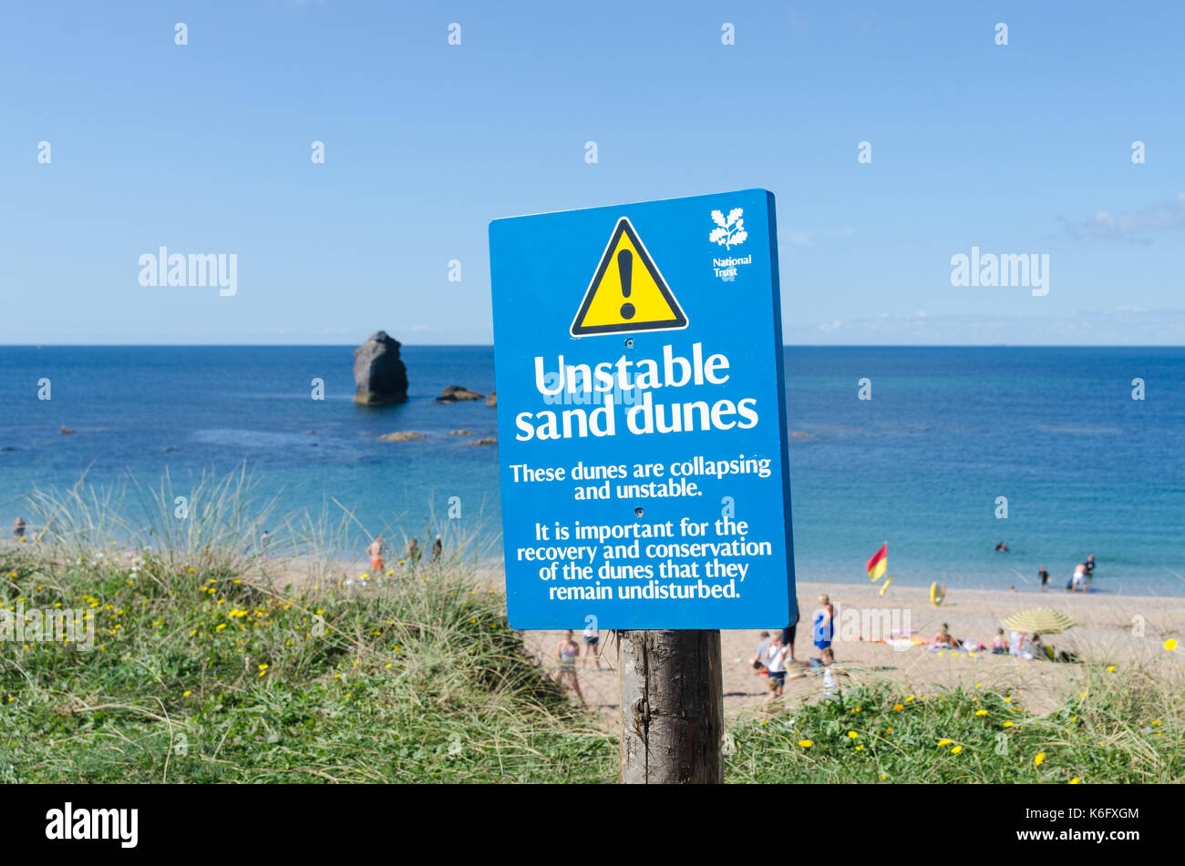 Sign warning of unstable sand dunes on the beach at South Milton Sands ...