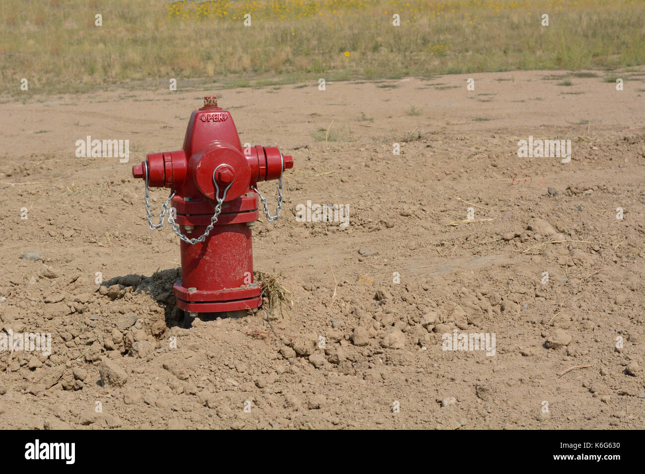 Red fire hydrant in empty field on bulldozed shopping center under new ...