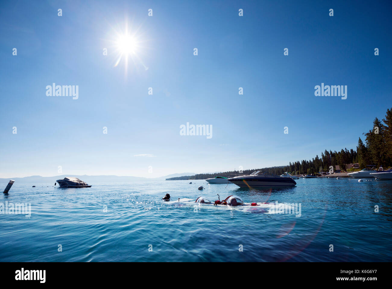 Prototype two-man personal submarine partially submerged in Lake Tahoe ...