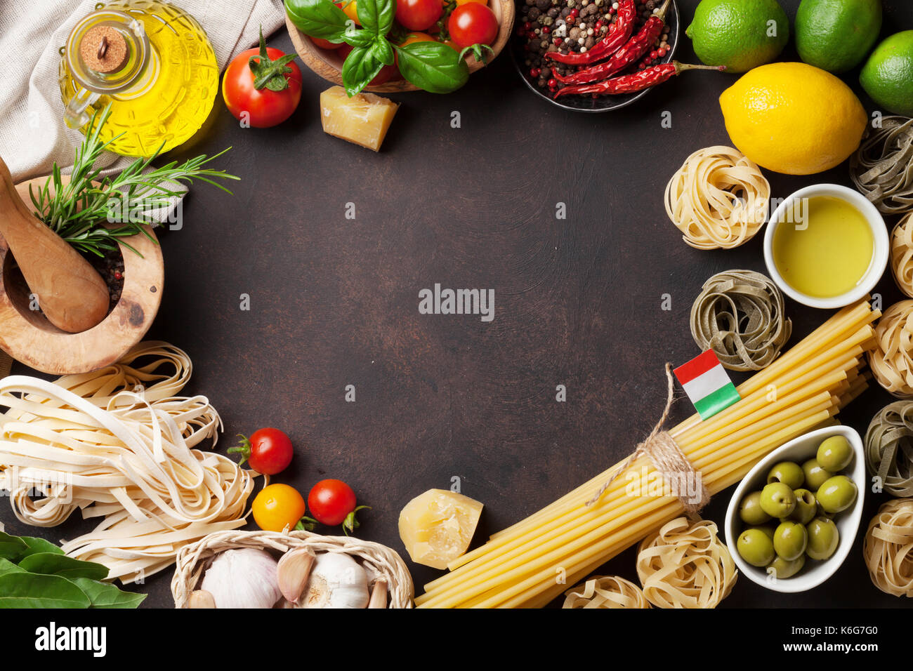 Italian food. Pasta ingredients on stone table. Top view with space for ...