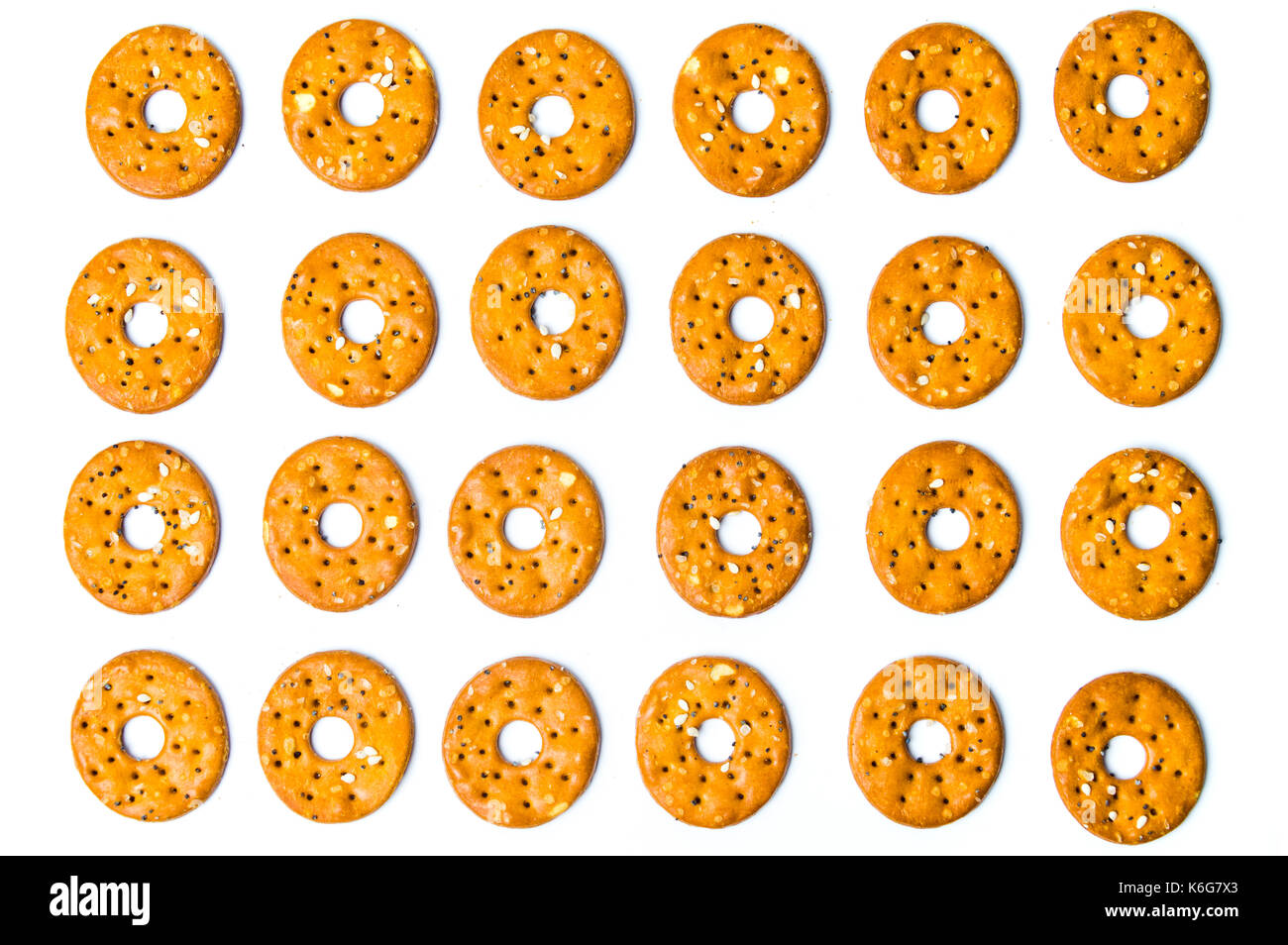 Round salty pretzels pattern isolated on white background Stock Photo ...