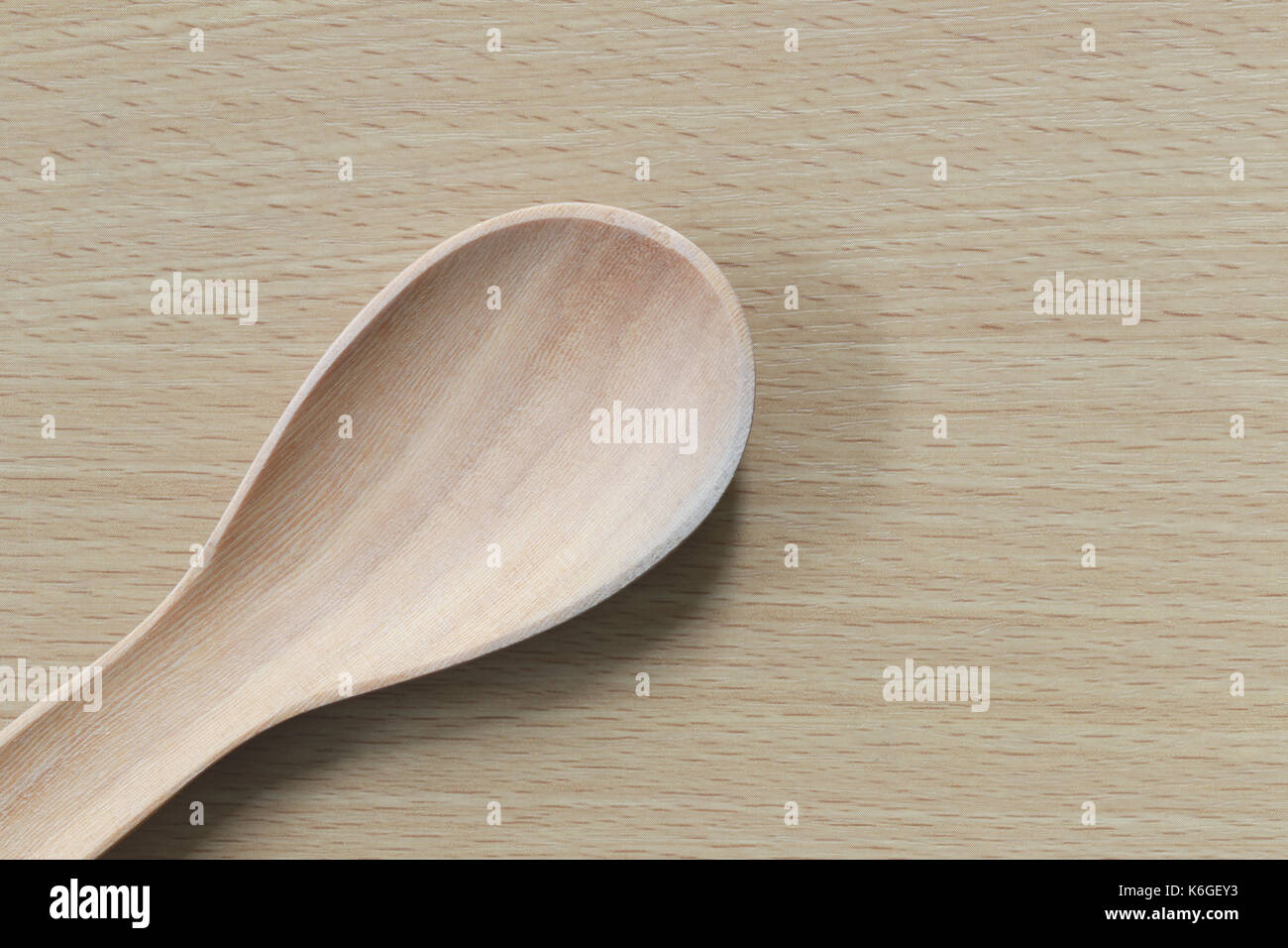 Empty wooden spoon on wood floor in food design concept Stock Photo - Alamy