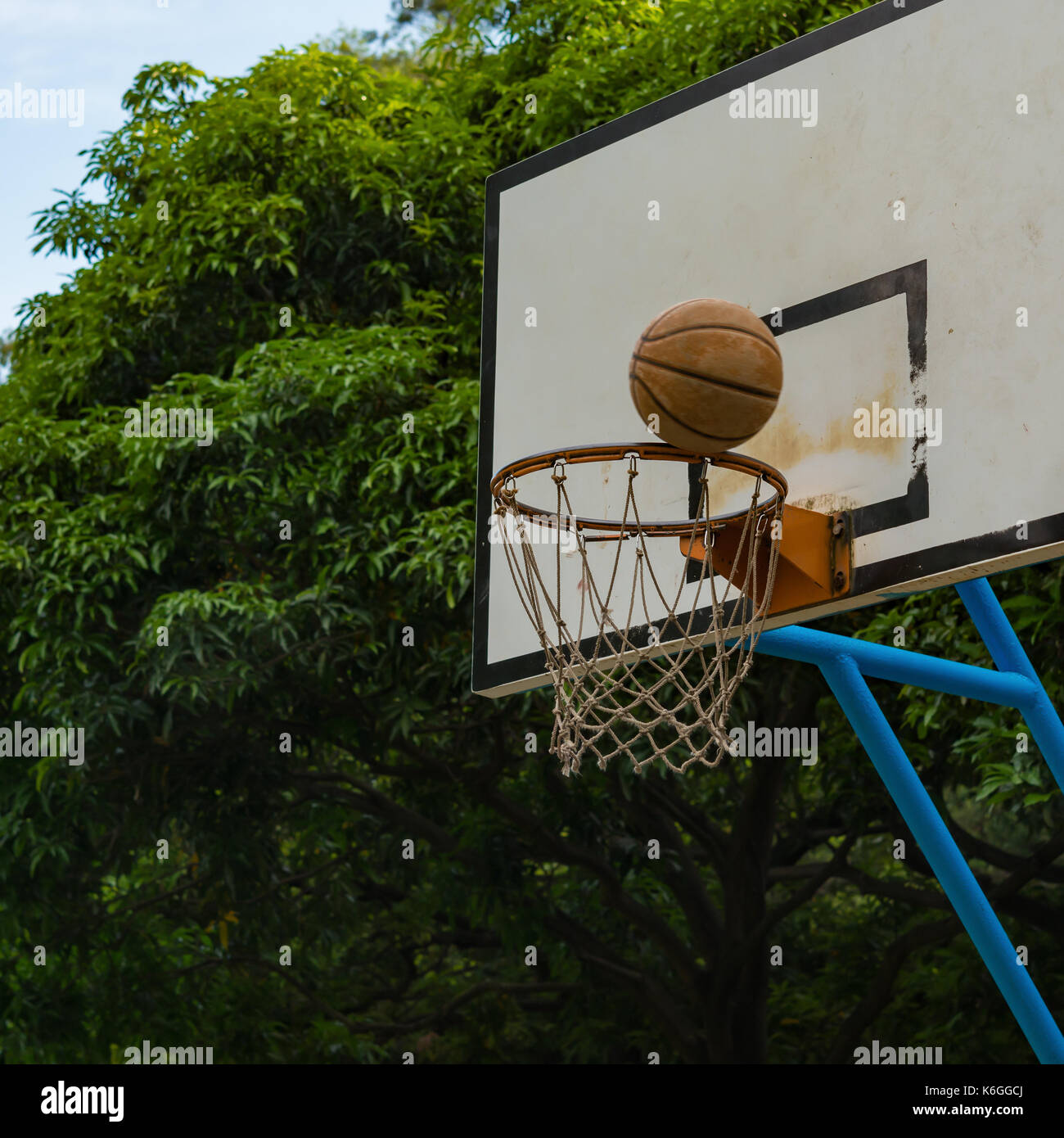 basketball on the rim of the hoop Stock Photo - Alamy