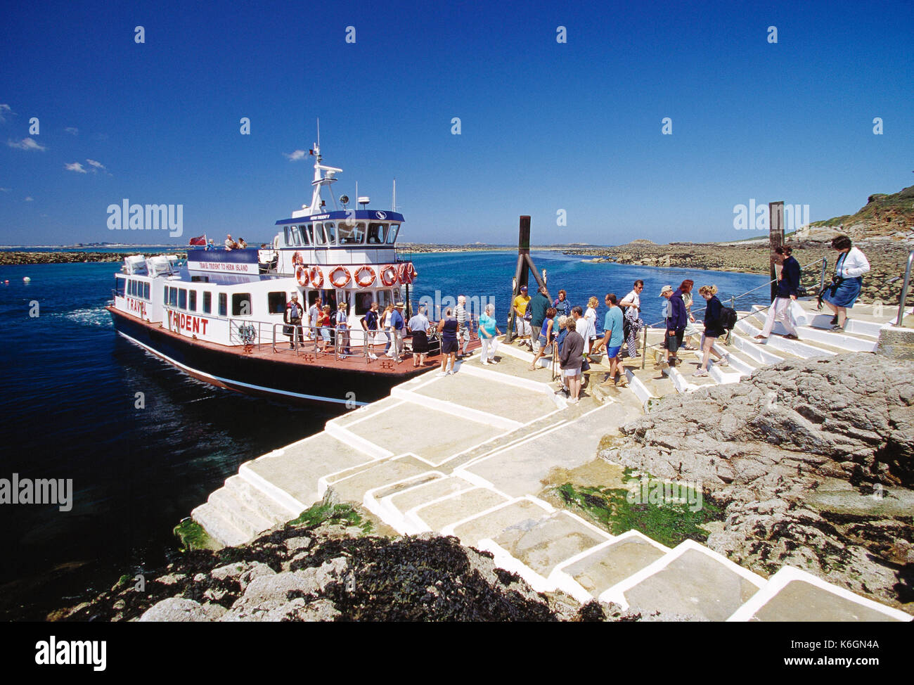 Guernsey. Trident ferry boat offloading passengers at Herm Island ...