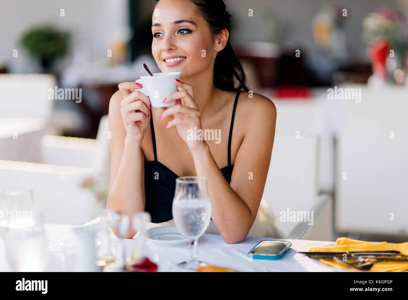 Beautiful women drinking tea in restaurant Stock Photo - Alamy