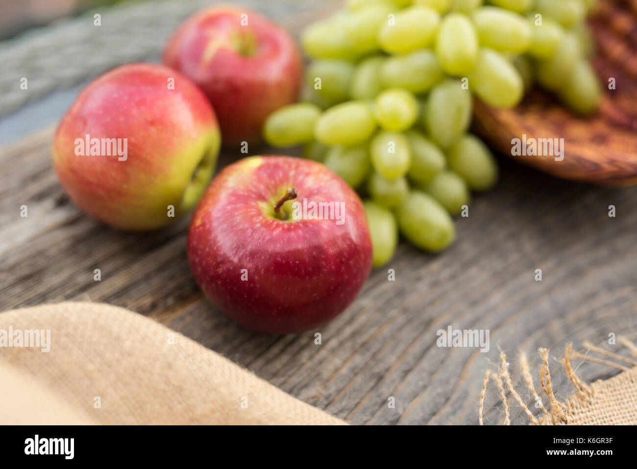 Vintage table with apples and raison. Decoration of a outdoor simple ...