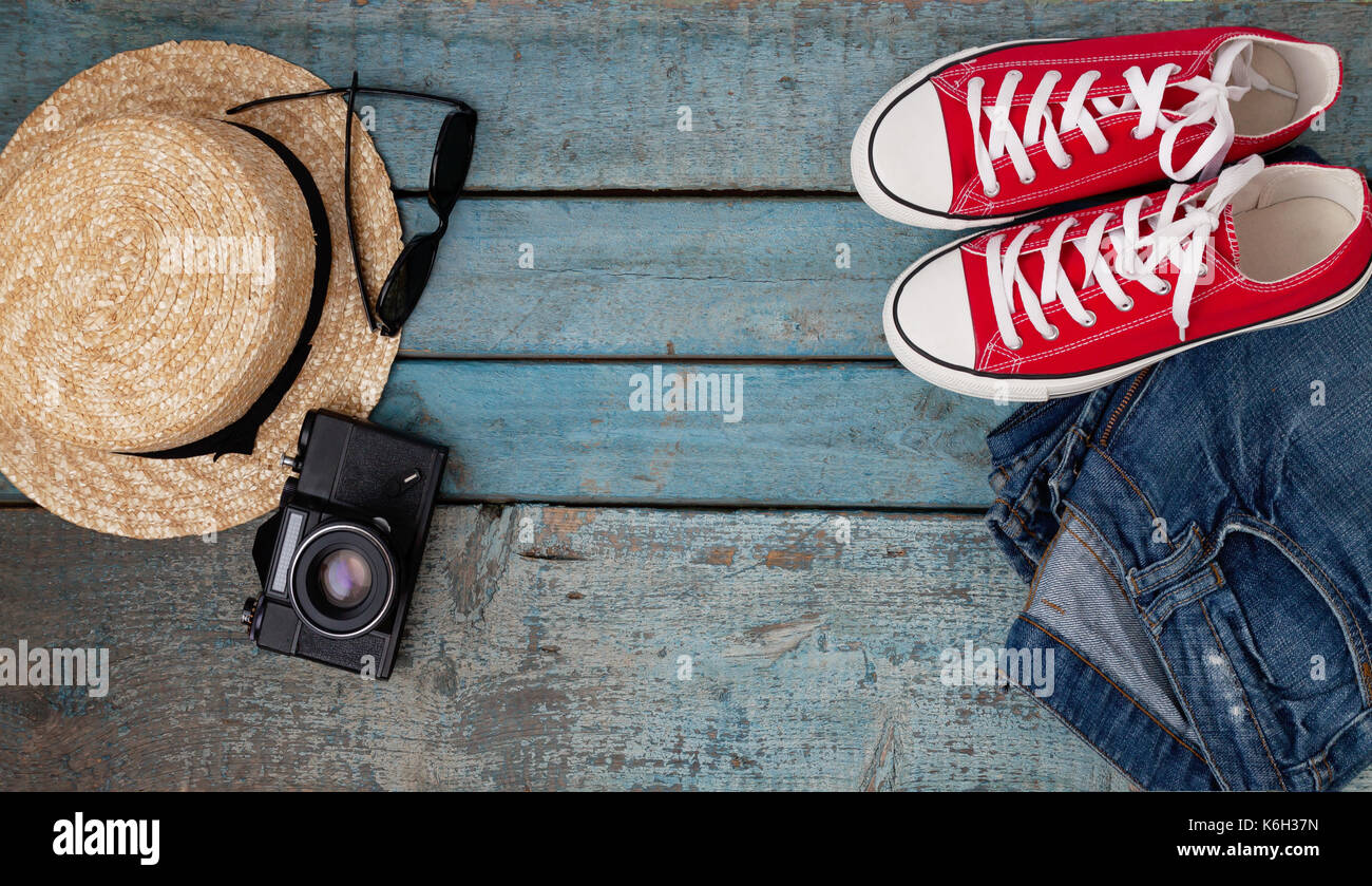 Still life of various items for recreation, clothing, hat, sneakers ...