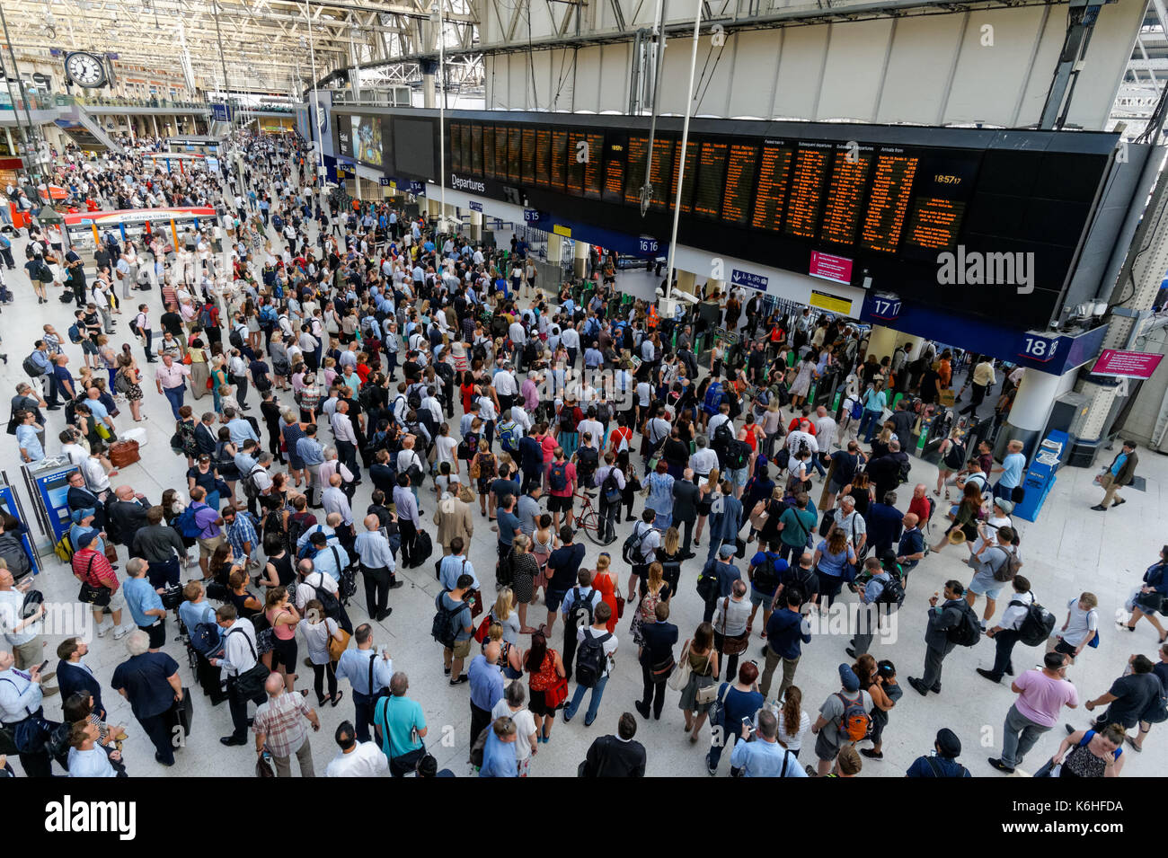 Passengers at Waterloo Station concourse wait for delayed trains ...