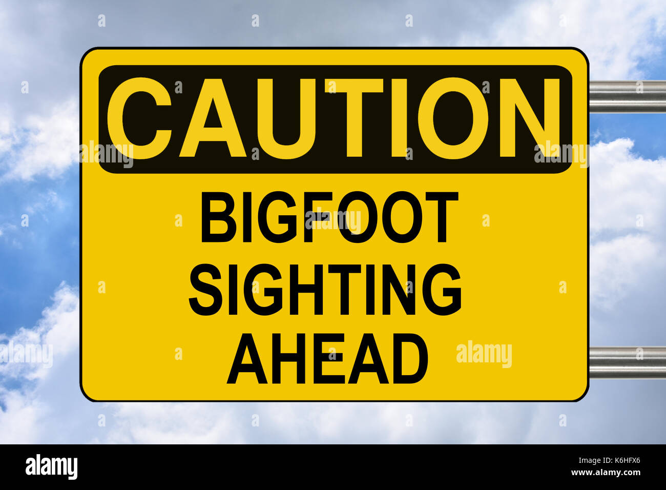 Bigfoot sighting ahead, yellow warning road sign Stock Photo - Alamy