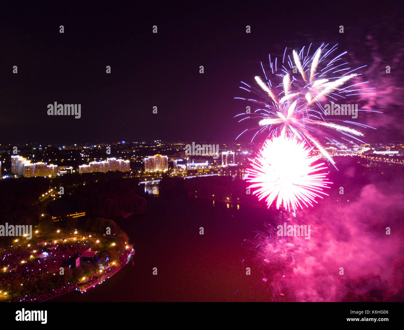 Firework shoot from drone. River and night city view. Musical festival ...