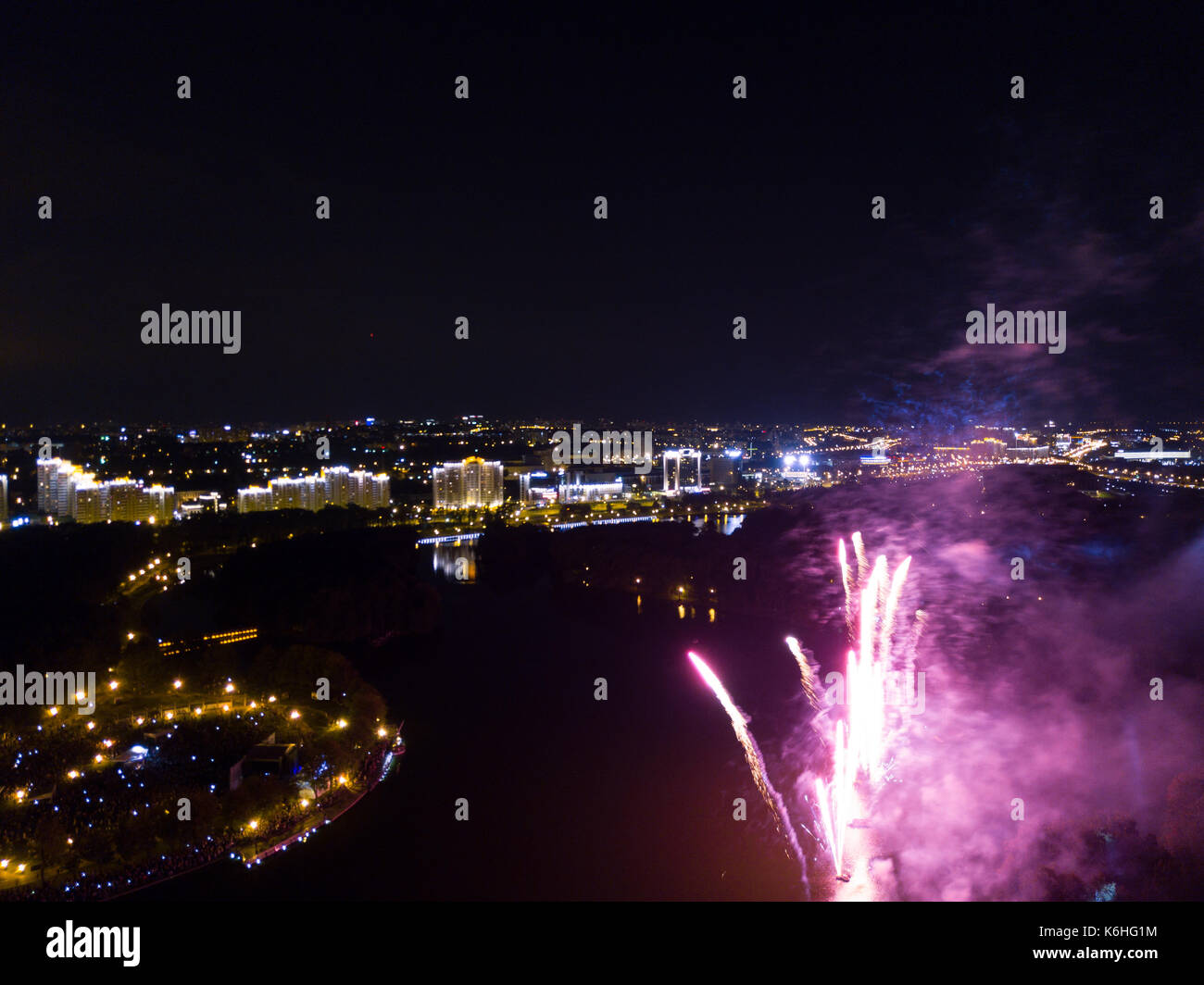 Firework shoot from drone. River and night city view. Musical festival ...