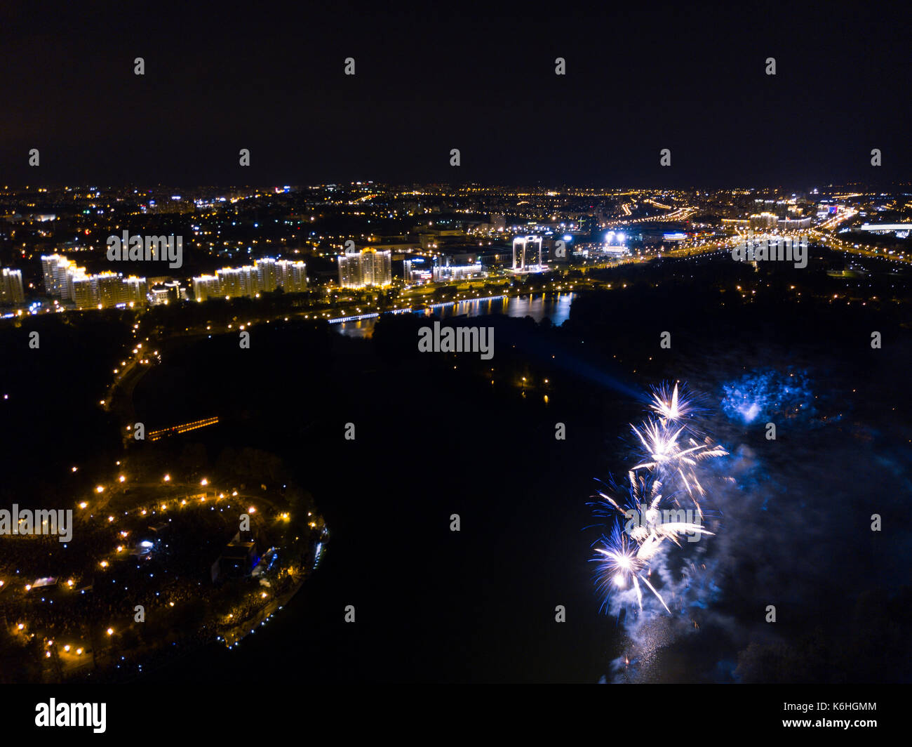 Firework shoot from drone. River and night city view. Musical festival ...