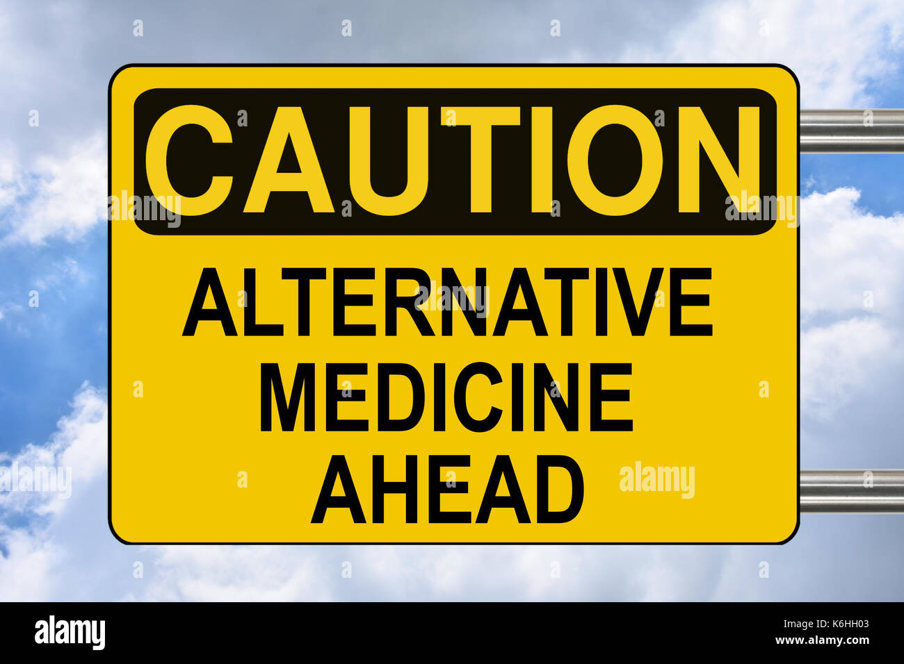 Alternative medicine ahead, yellow warning road sign Stock Photo - Alamy