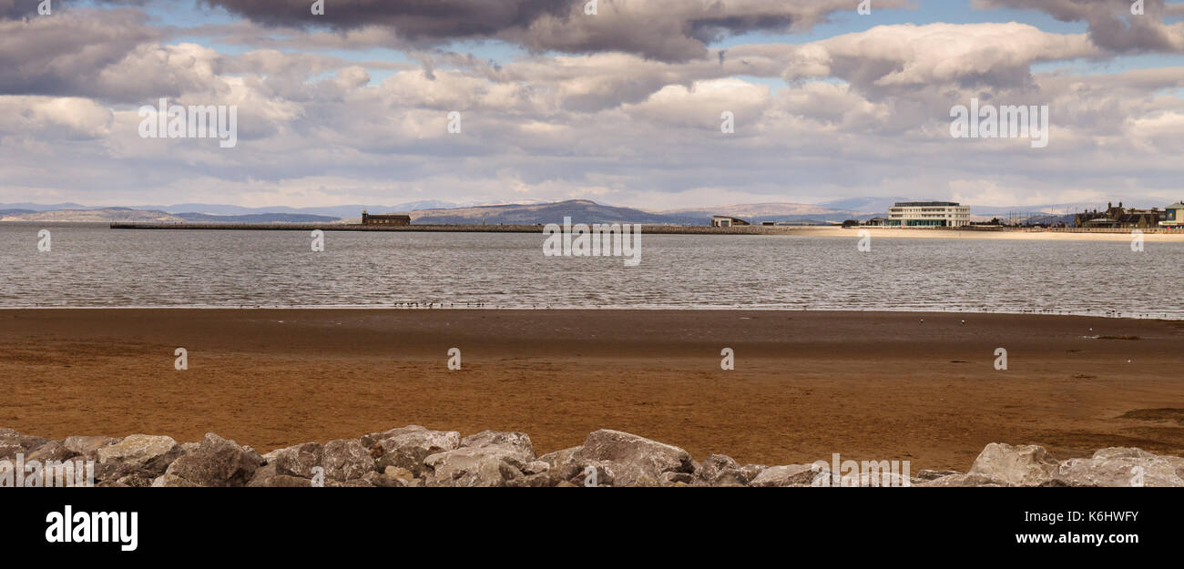 The long Morecambe Pier stretches out from the town's sandy beach and ...