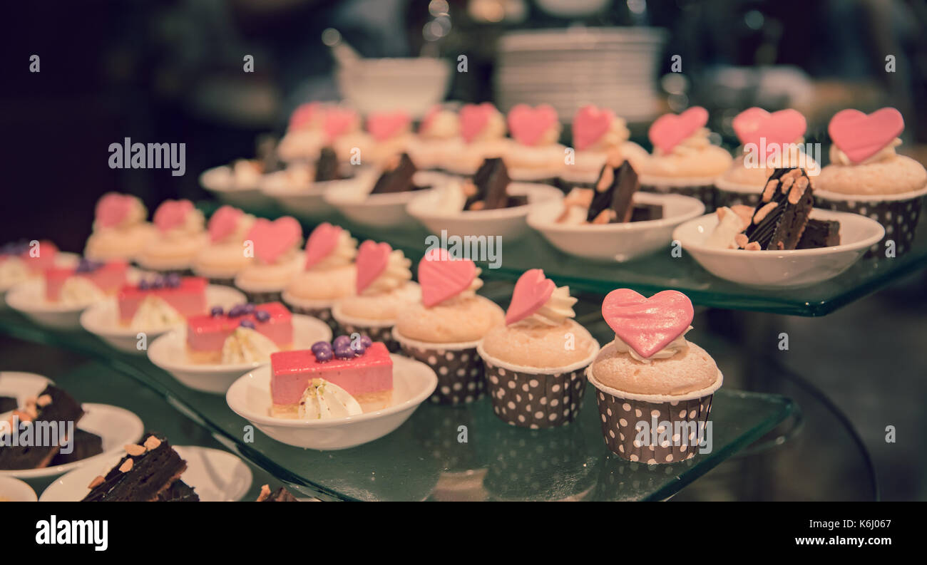 Cocktail party background selective focus on cup cake, display to ...