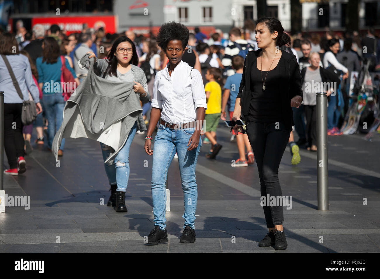 LONDON, ENGLAND - August 11 2017 A multicolored crowd walks along ...